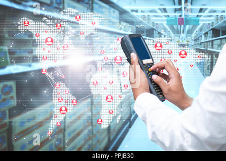 A worker scanning cargo with bluetooth barcode scan. Reading and ...