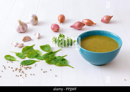 Zucchini soup with spinach and herbs at white Stock Photo - Alamy
