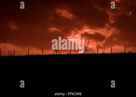 Cinematic horror scenario, deep red sky, with massive black clouds ...