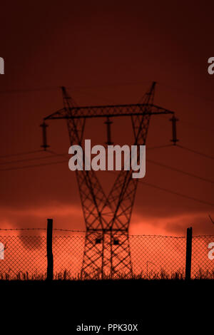 Cinematic horror scenario, deep red sky, with massive black clouds ...