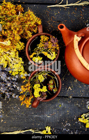 Two Cup of herbal tea - tutsan, sagebrush, oregano, helichrysum ...