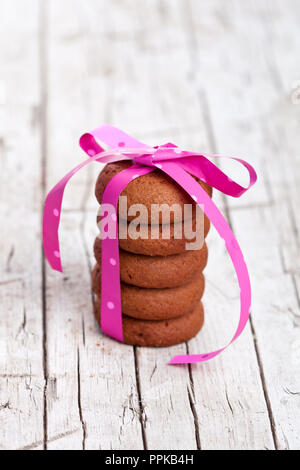 fresh cookies stacked with a bow tied together with background Stock ...