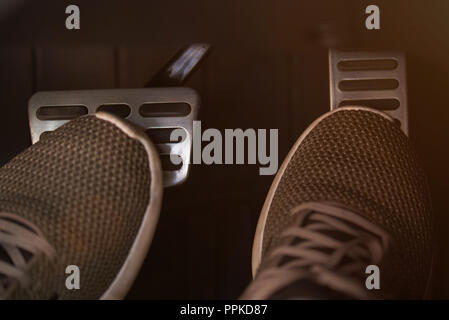 foot pressing the brake pedal of a car Stock Photo - Alamy