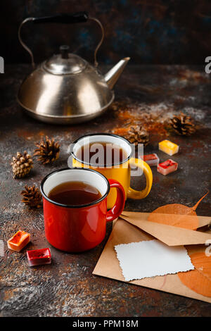 Enameled Two cups of tea in nature on wooden background, love, travel ...