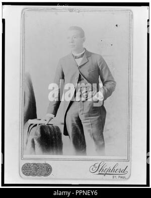 A three-quarter length portrait of Booker T. Washington, the prominent ...