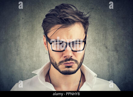 Annoyed and skeptical guy complain on something stupid, pointing finger ...