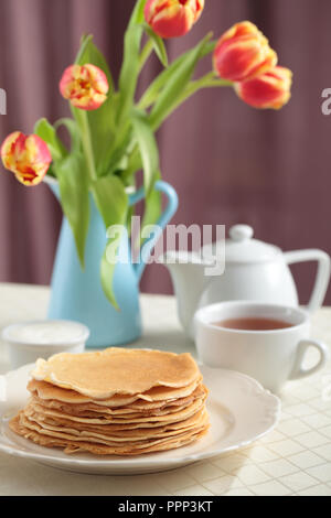 Stack of Pancakes on the Table with Tulips Stock Photo - Alamy