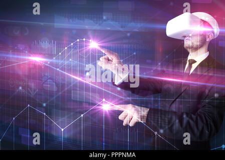 Businessman with virtual reality goggles organizing 3D graphs charts ...