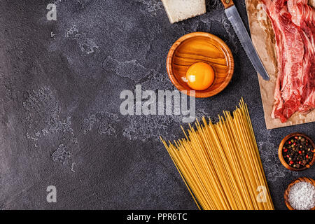 Ingredients for Pasta Carbonara on dark background, top view Stock ...
