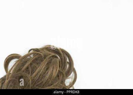 Brunette curly hair tuft isolated on white background Stock Photo - Alamy