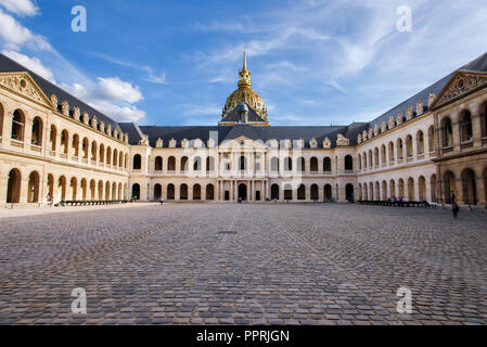 Les Invalides Palace courtyard, with old cannons in a sunny day at ...