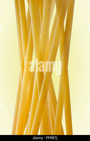 A group of Italian pasta called linguine on a light background ,long ...