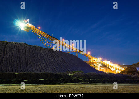 Crushed ore stock pile and feeder at mine site processing plant Stock ...