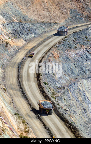 Truck carting ore from open pit mine up ramp for processing. Western ...