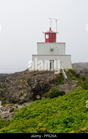 Amphitrite Point Lighthouse on a foggy day in Ucluelet, British ...