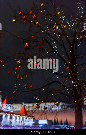 Image of christmas tree and spots of light on green background ...