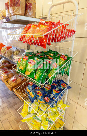 Snacks rack with packets of junk food Kurkure and Lays wafers India ...