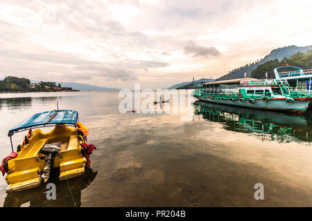 Parapat coastal town on banks of Lake Toba in the Uluan Peninsula ...