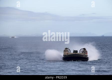 U.S. Marines approach the USN training boat USNS Hunter during search ...