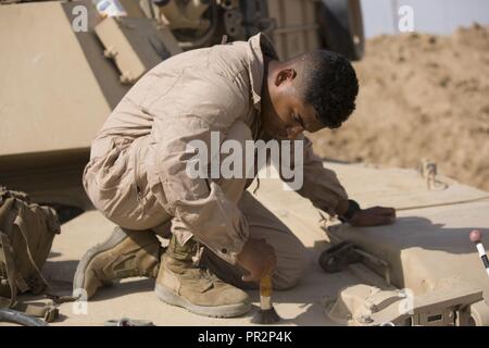 A U.S. Marine Corps tank crewman with Company B, 2nd Tank Battalion ...