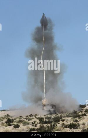 A mine clearing line charge (MCLIC) fired by U.S. Marine Corps M1 ...