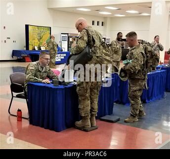 Soldiers from the 646th Regional Support Group HHC get some rest while ...
