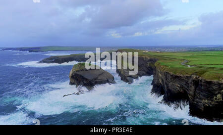 The beautiful steep cliffs of Kilkee at the Irish west coast – aerial ...