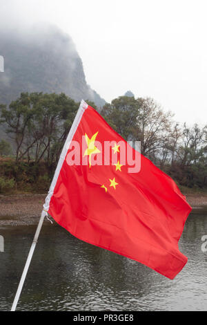 national flag of China red color and yellow stars close up Stock Photo ...