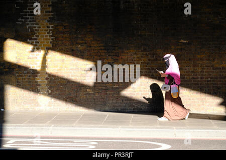 London, England, UK. Muslim woman in full-length Islamic dress at a ...