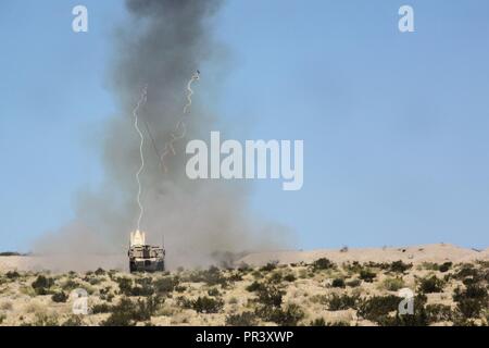 A mine clearing line charge (MCLIC) fired by U.S. Marine Corps M1 ...