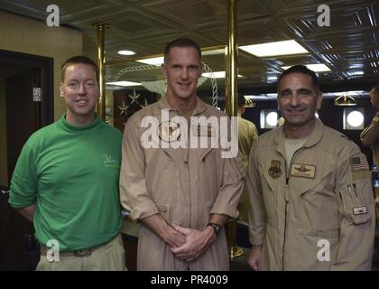 U.S. Navy Rear Admiral, Kevin Donegan speaks during a briefing in Hong ...