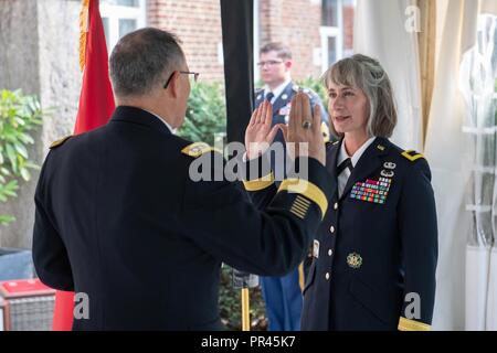 Brig. Gen. Amy Hannah, chief of SHAPE Public Affairs, accepts the rank ...
