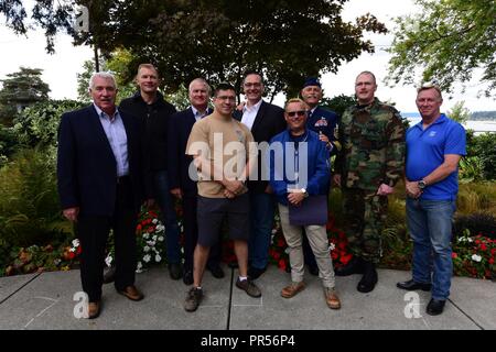 U.S. Coast Guard plank owners stand at parade rest during during the ...