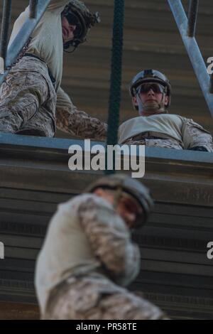 U.S. Marine Corps drill masters with Recruit Training Regiment lead a ...