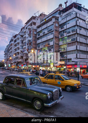 Evening lights on streets of Latakia, Syria Stock Photo - Alamy