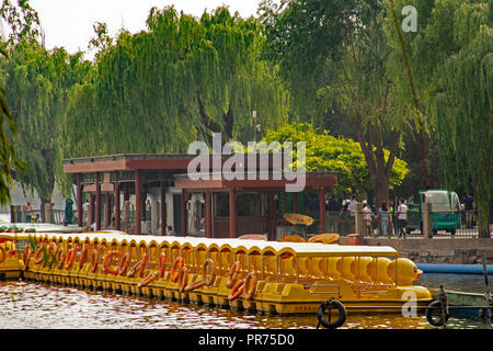 Pedal boats in the Taiye lake view the White Pagoda at the Beihai Park ...