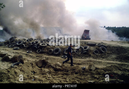 September 1996 - Air - Burning trash at landfill, tires in the ...