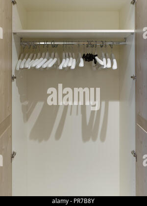 Open door of an empty clothes closet Stock Photo - Alamy