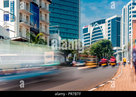 Street scene in downtown Kigali reflected on modern building, Rwanda ...