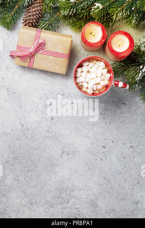 hot chocolate, christmas gift and candles on table Stock Photo - Alamy