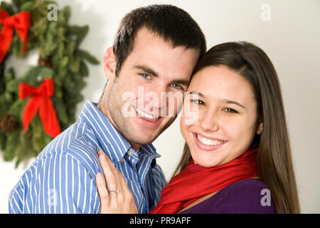 Young man in Christmas concept at home Stock Photo - Alamy