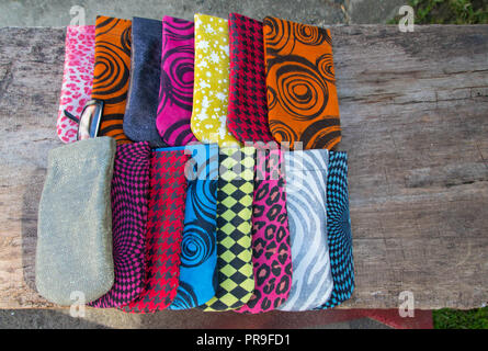 Colorfull leather eye glass cases on wooden background Stock Photo - Alamy