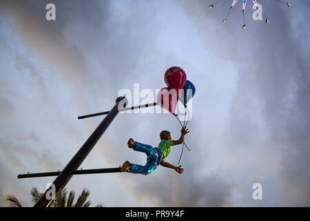 Funfair rides at night fall in orlando Stock Photo - Alamy