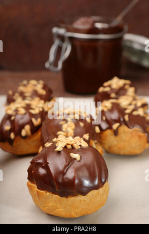 Traditional French dessert. Eclair with cream, chocolate icing ...