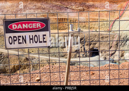 Danger sign warning of open mine shafts in the opal fields of Coober ...