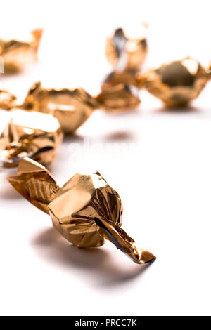 golden sweets closeup on white background Stock Photo - Alamy
