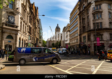 Busy street in Holborn, Central London, with corner flower stand, and ...
