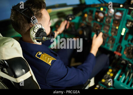 Airline pilot work in the cockpit Stock Photo - Alamy