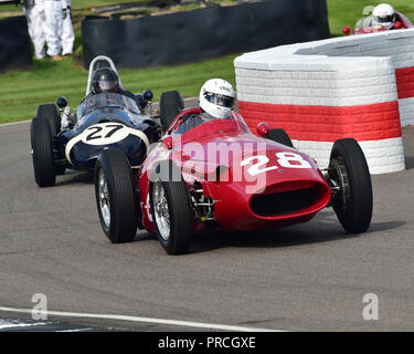 1954 Maserati 250F of Graham Adelman pulls ahead of Simon Diffey in the ...