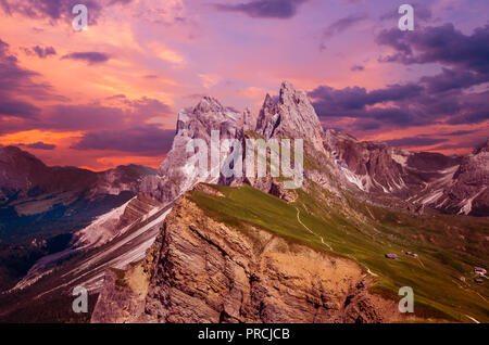 The beautiful Dolomites group of Odle at sunset with moon in the ...